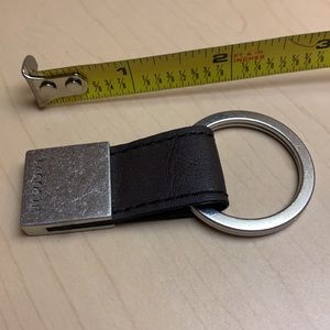 Lacoste | Accessories | Lacoste Metallic And Brown Leather Keychain ...